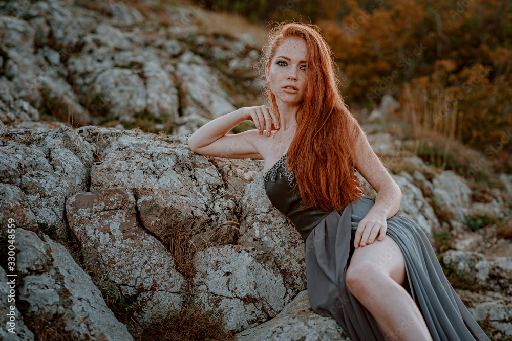 beautiful furious scandinavian warrior ginger woman in grey dress Stock ...