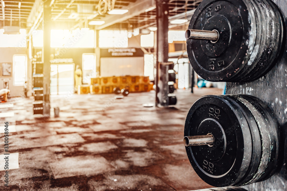 Rusty weight stack in a gym sunny day with copy space for banner ...