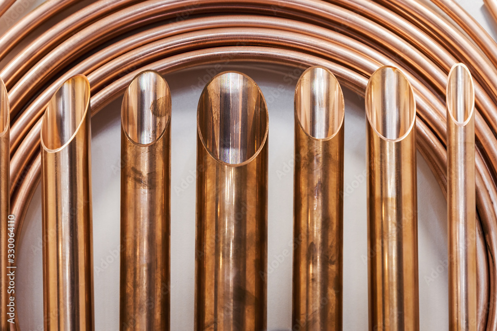 samples of copper tubes and rolled tubes. Focus in the middle of the ...