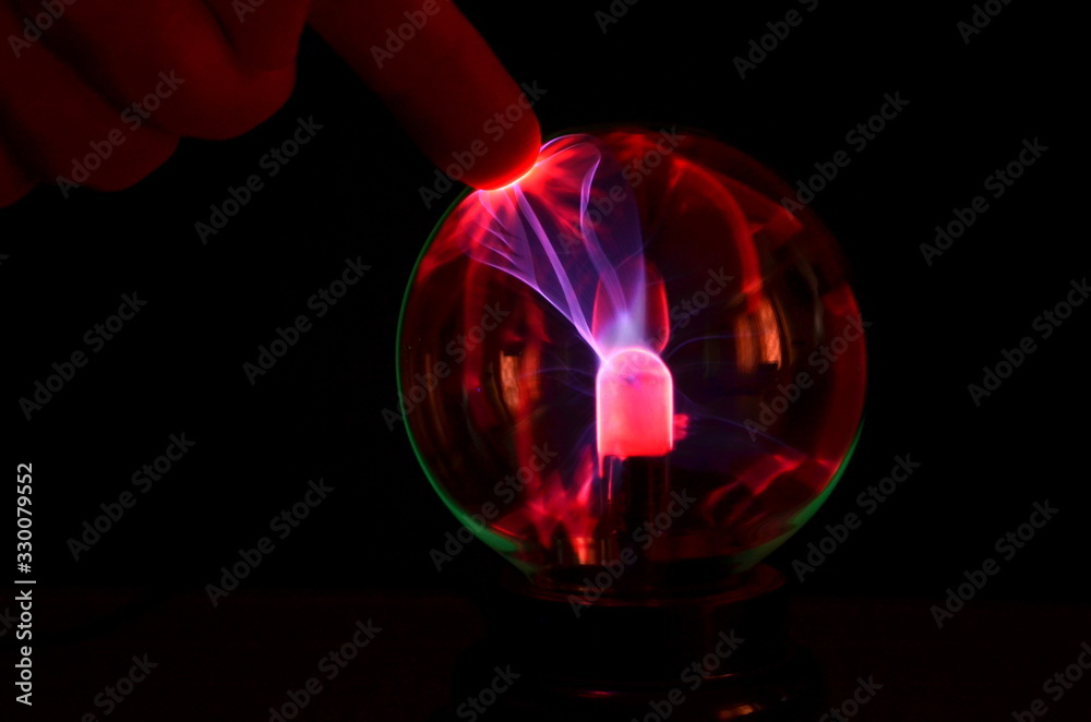 Plasma ball Static Electricity light on black background. lighting on ...