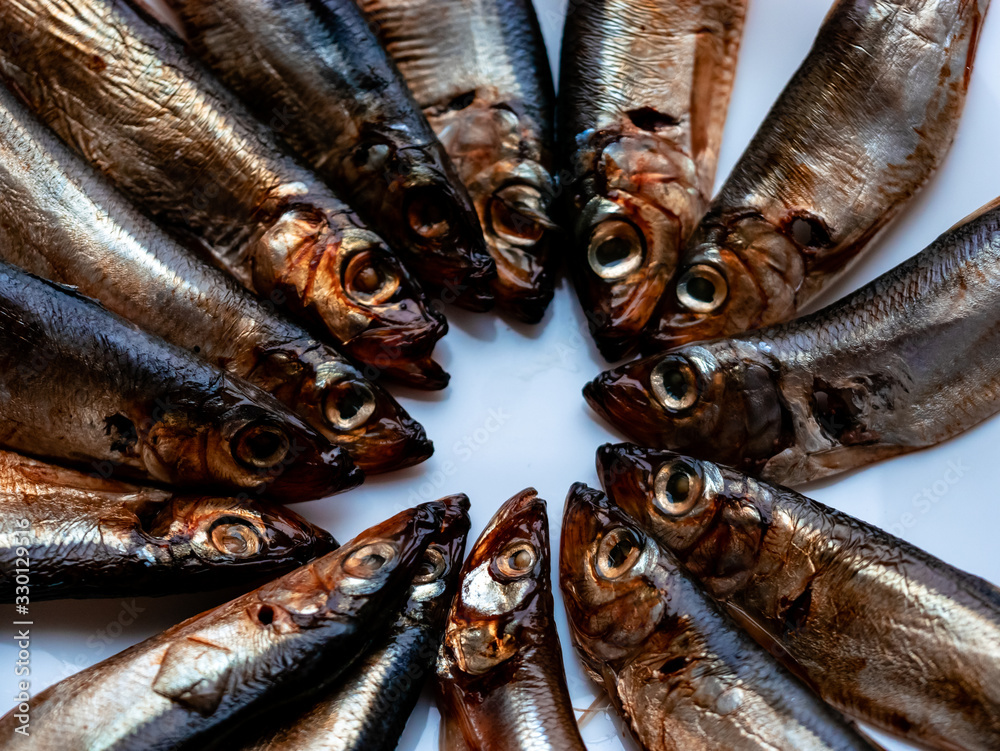 Cold smoked salaka ready to eat. Smoked fish close-up on a plate. Sea ...