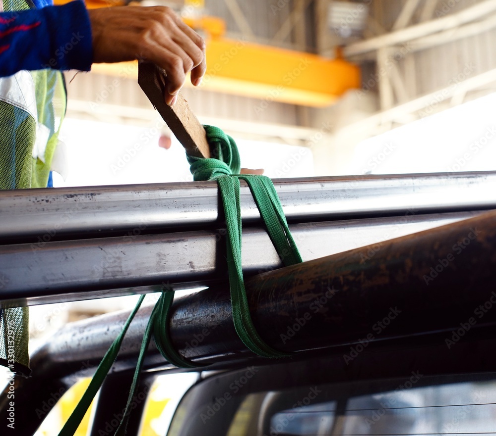 The iron is being tied up with a green rope and locked tightly.With the ...