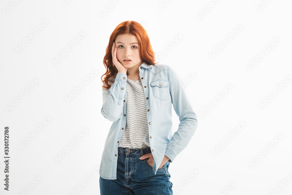 beautiful thoughtful redhead teen girl in denim clothes, isolated on ...
