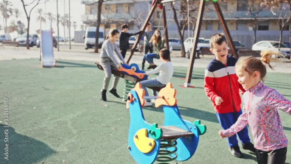 Smiling kids playing together on playground outdoors Stock Video ...