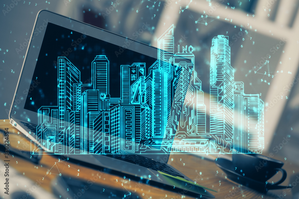 Desktop computer background in office and big town buildings hologram ...