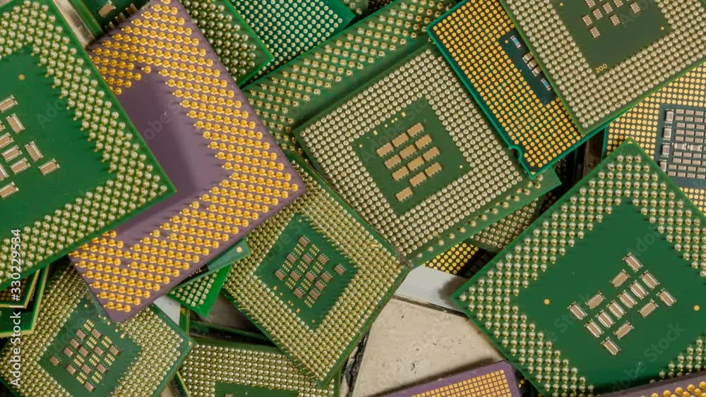 Panning across an assorted pile of CPUs. They were removed from ...