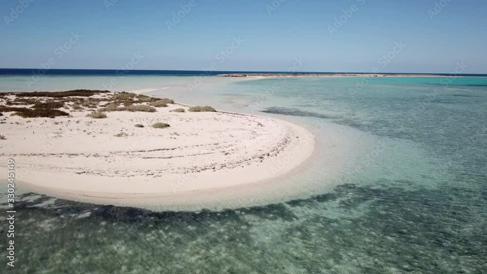Slow drone flight over beaches of protected Umluj island group in the ...