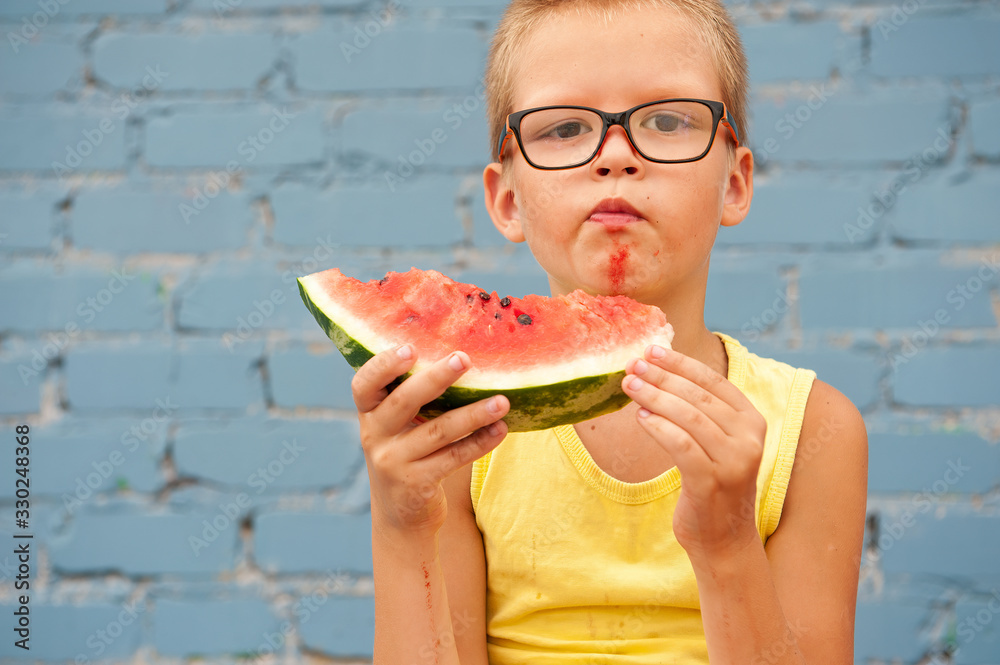 Funny village children eat watermelon sitting on old chest in courtyard ...