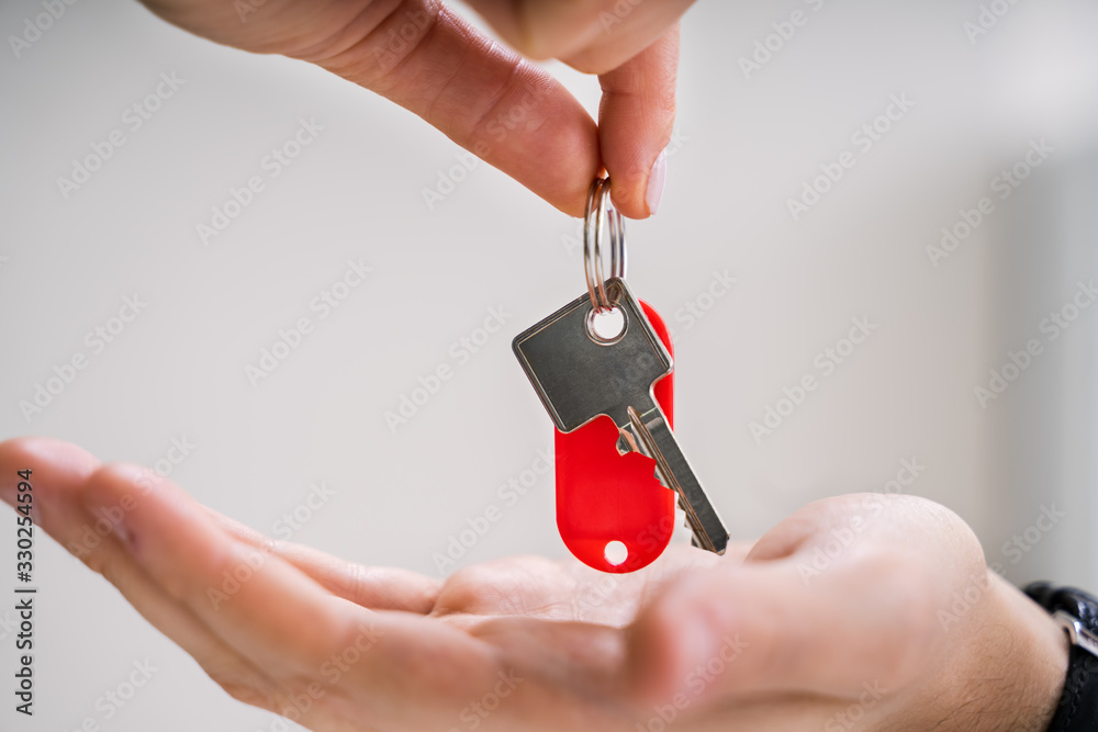 Hand Passing Keys To New Owner Stock Photo | Adobe Stock