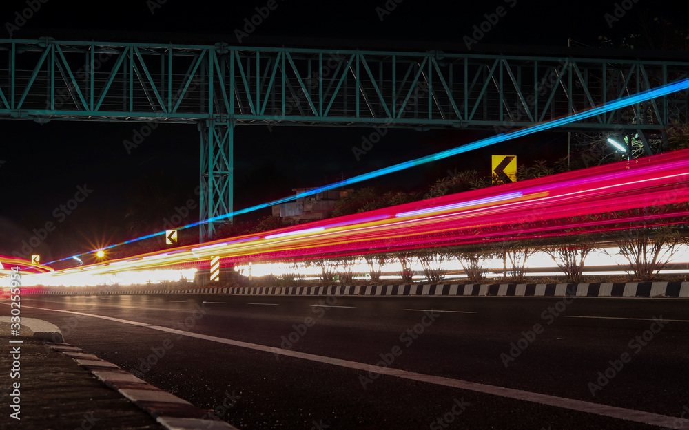 Light trails of the vehicles on the Indian National highways. A shot ...