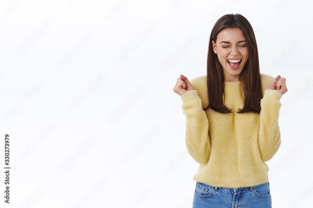 Happy girl jumping and scream from happiness and joy as winning, feel ...