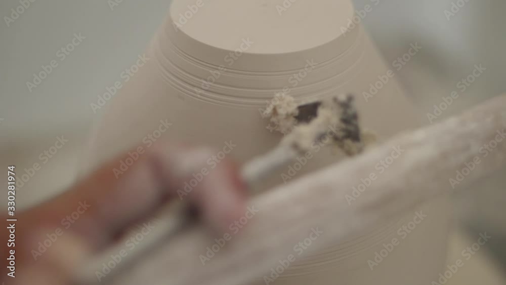 man modeling plaster clay cast pottery with ceramic tools Stock ビデオ ...