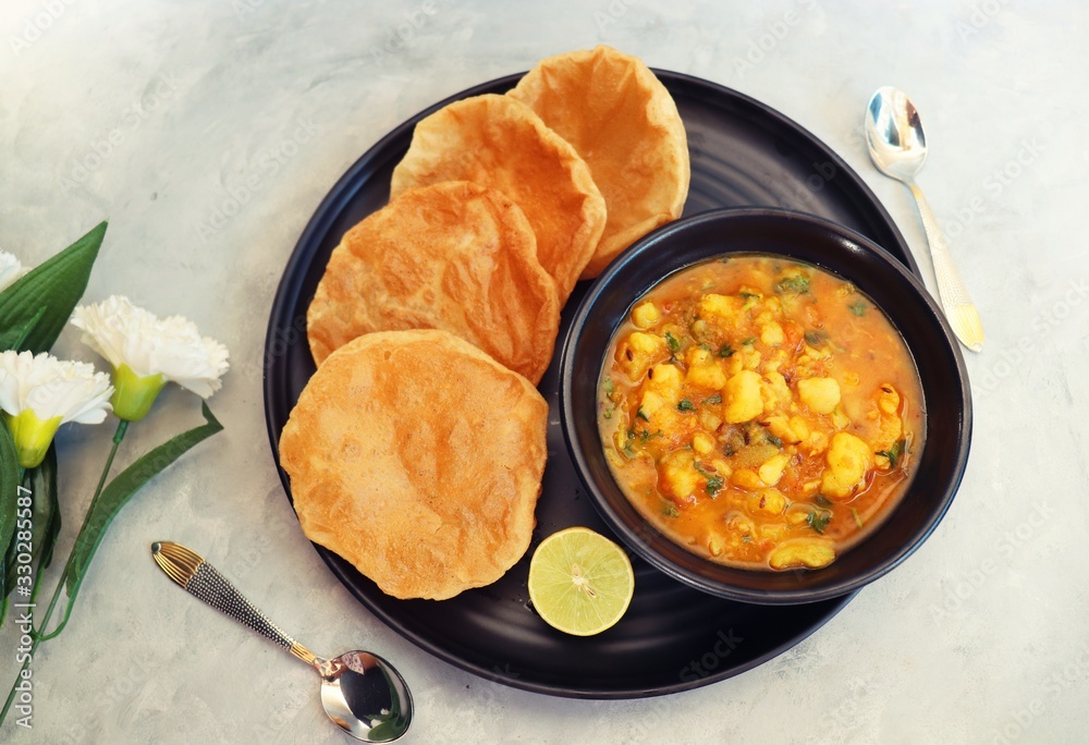 Indian cuisine - Puri Bhaji. It is a traditional breakfast dish in ...
