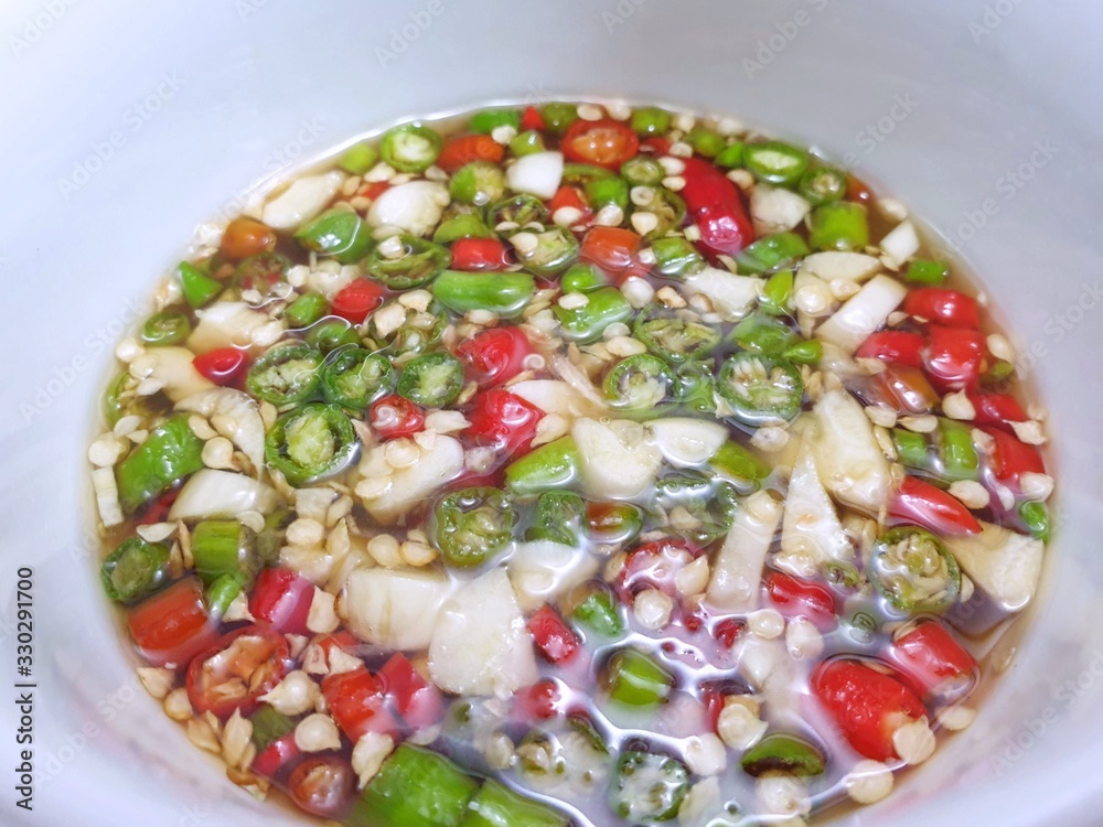 Thai food style, Top view of chilli and fish sauce with garlic in white ...