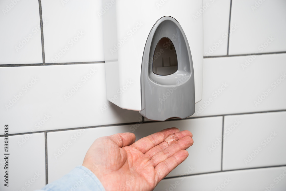Wall hand pump sanitizer soap gel dispenser. Hand washing and good ...