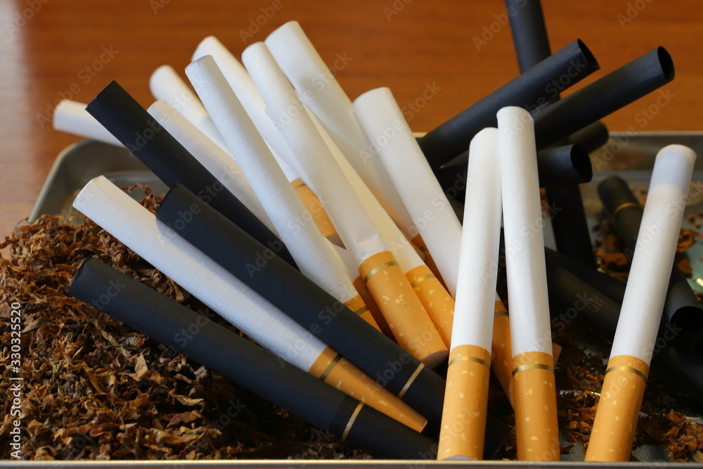 cigarette filters Empty cigarette paper Several white and black ...