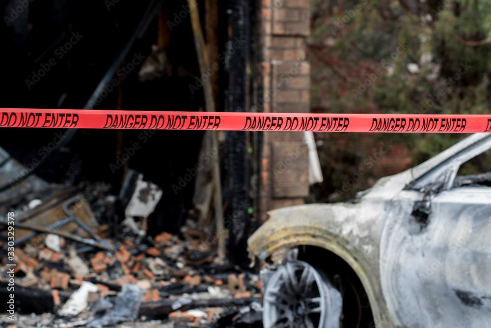 House and car destroyed by fire. Crime scene investigation of home and ...