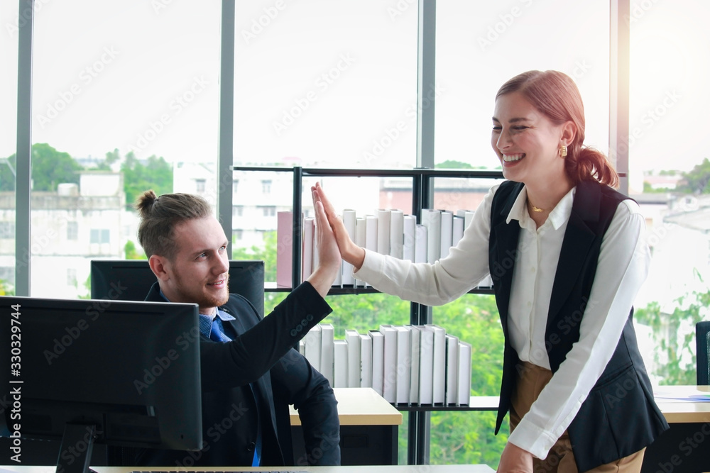 Foto de Cheerful and happy achievement successful businessman and woman ...