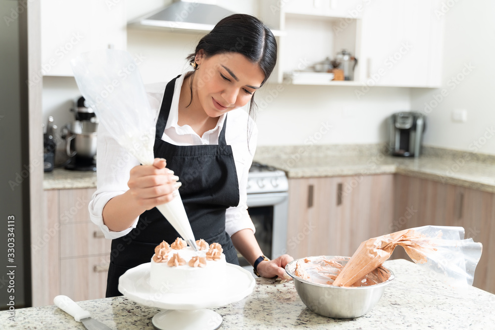 Beautiful Female Pastry Chef Preparing Cake At Home Stock Photo | Adobe ...