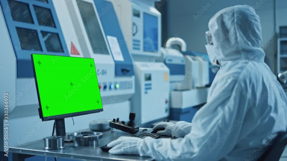 Factory Cleanroom: Engineer Wearing Coveralls Does System Control on ...