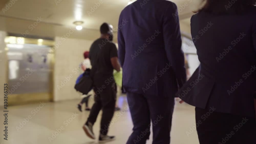Business woman and man leaving work heading home Grand Central Station ...