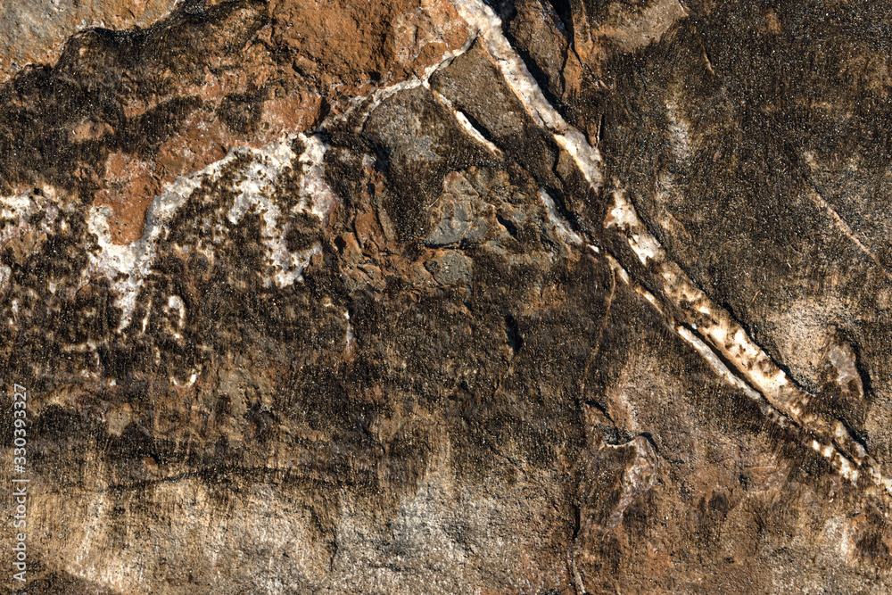 natural surface of brown stone with black and white spots, rock texture ...