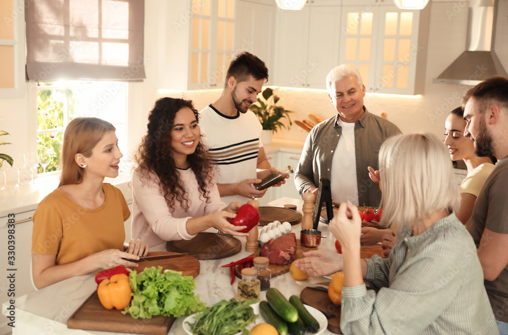 People Cooking Food In The Kitchen