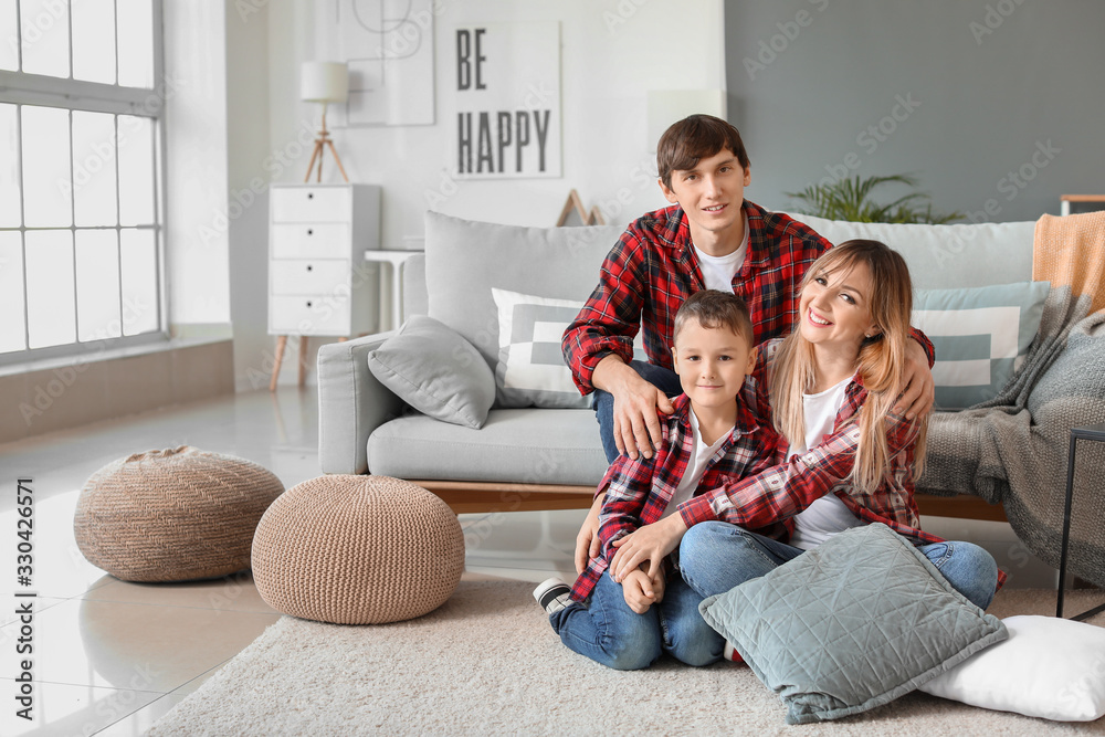 Portrait of happy family resting together at home Stock Photo | Adobe Stock