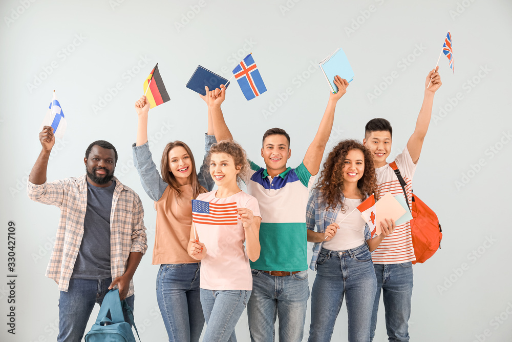 Young students of language school on color background Stock-Foto ...