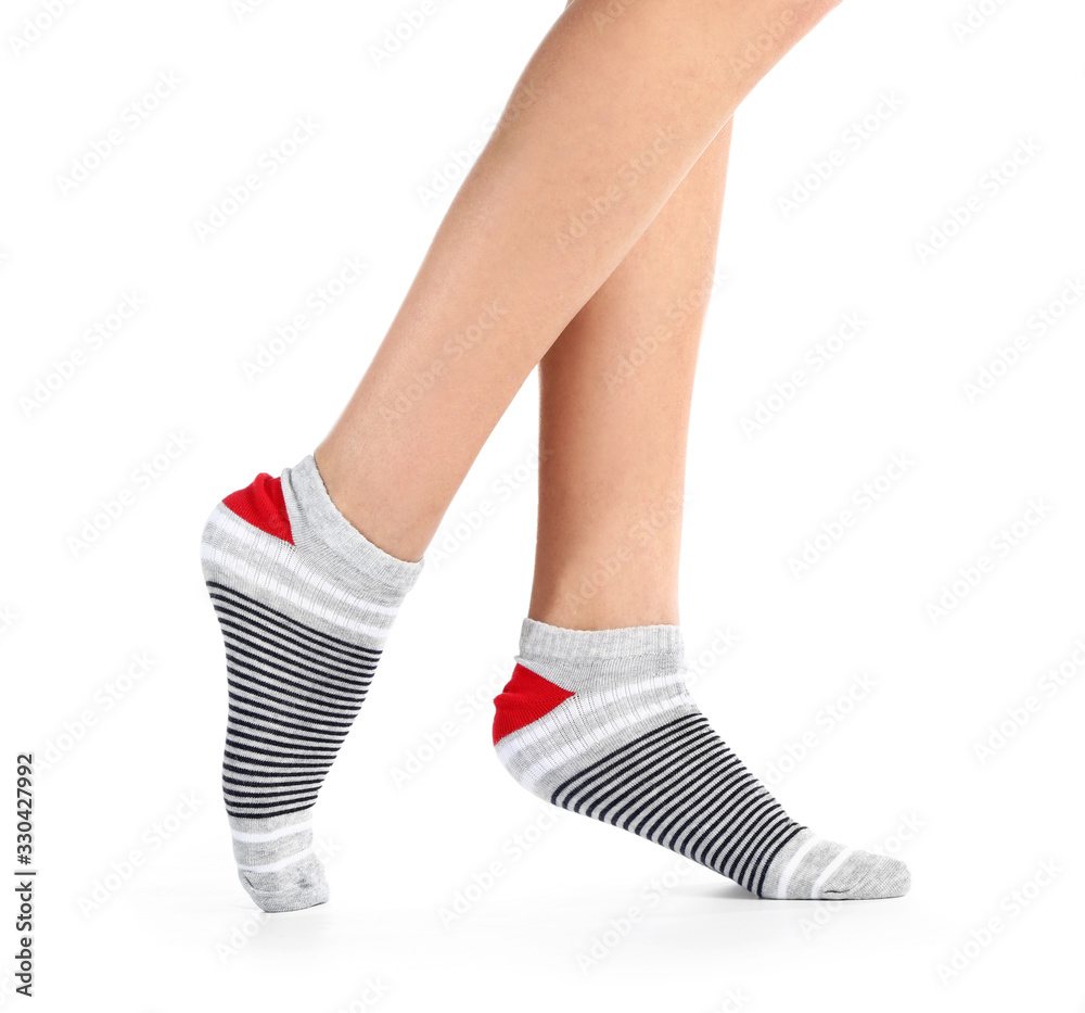 Legs of young woman in socks on white background Stock Photo | Adobe Stock