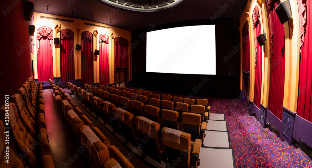 Cinema theater screen in front of seat rows in movie theater showing ...
