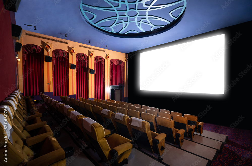Cinema theater screen in front of seat rows in movie theater showing ...