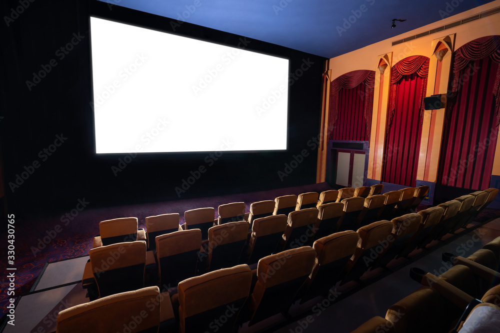 Cinema theater screen in front of seat rows in movie theater showing ...