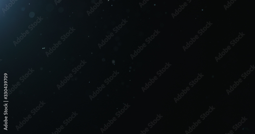 natural dust particles float in air on black background Stock Photo ...