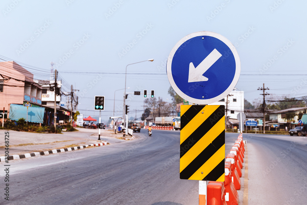 traffic signs with road directions must enter the left lane with soft ...