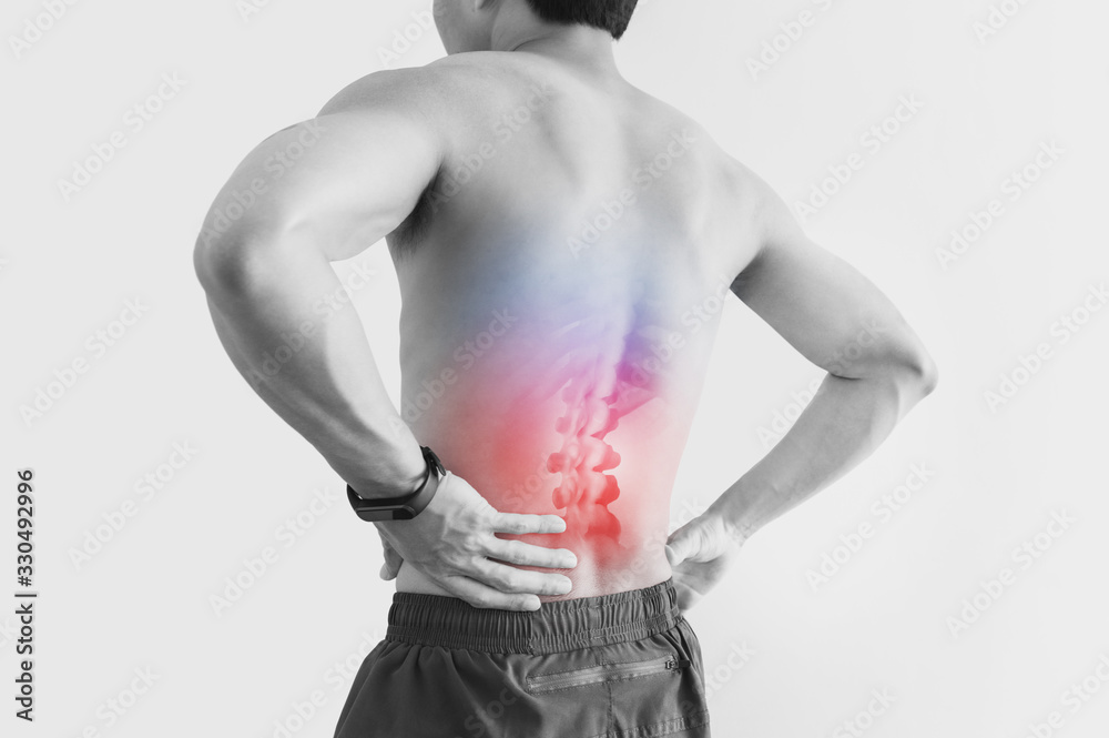 Lower back pain. Shirtless man touching his back with red highlight, on ...