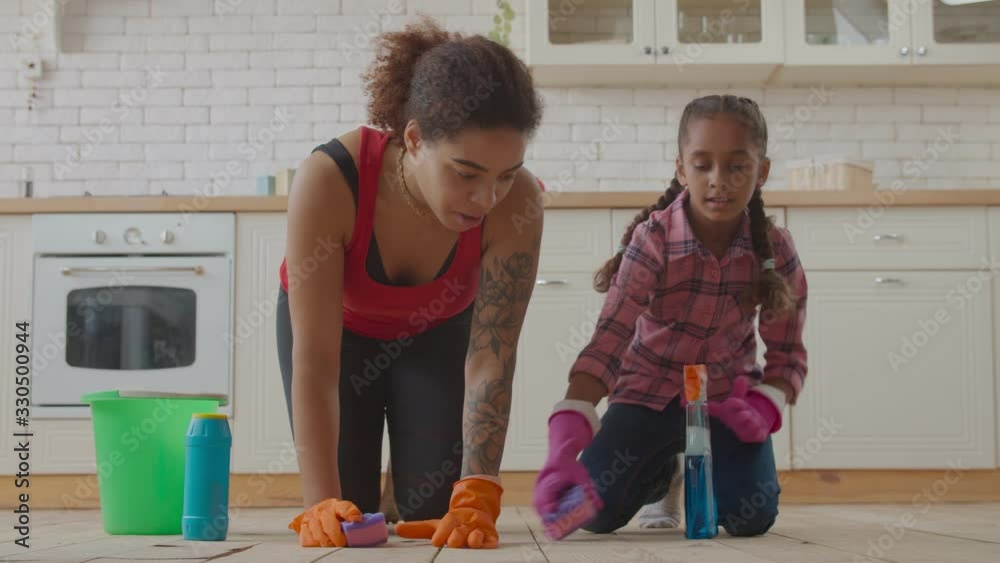 Pretty african american mother and cute elementary age daughter in ...