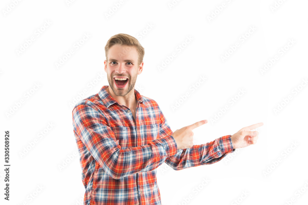 Attracting attention. Happy man pointing at isolated on white. Handsome ...