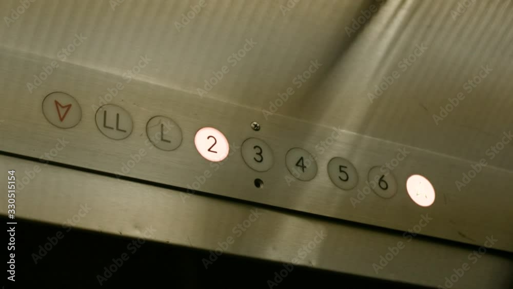 Elevator floor sign indicator lights turn on as elevator climbs floors ...