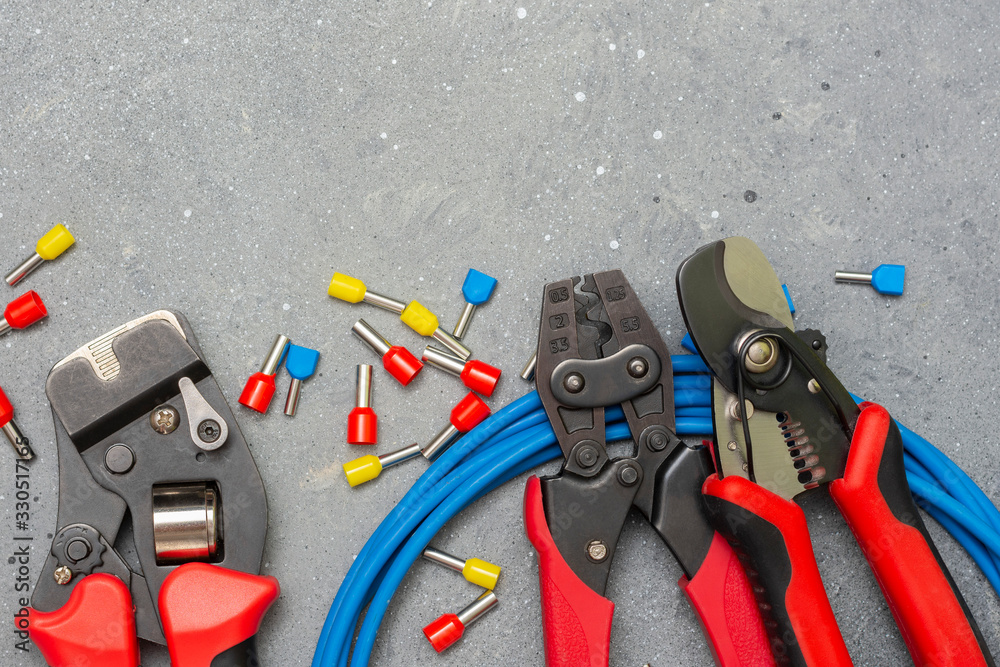 Tools and tips of different sizes and colors for crimping stranded ...