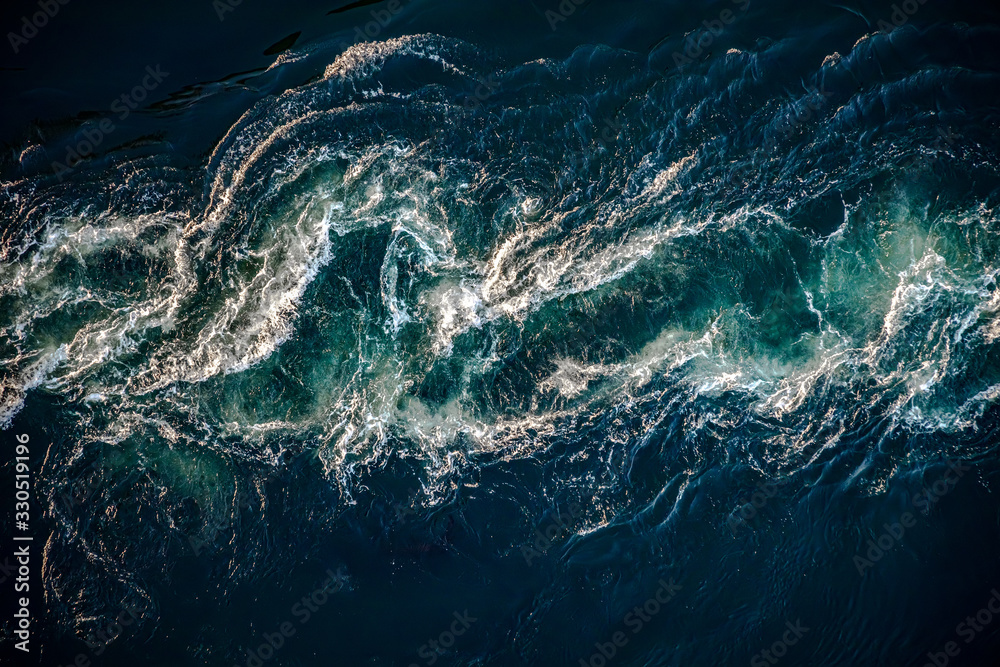 Waves of water of the river and the sea meet each other during high ...