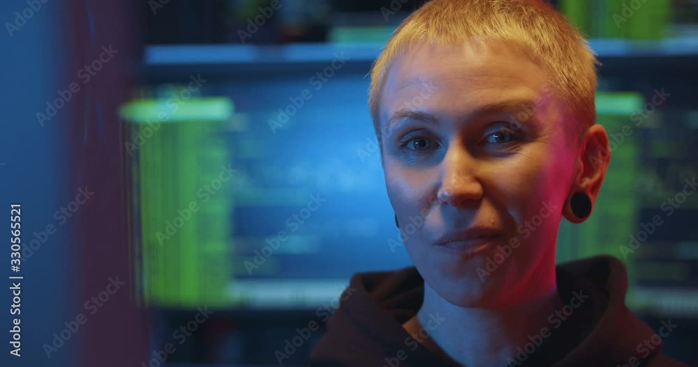 Portrait of Caucasian daring female hacker with short blond hair ...