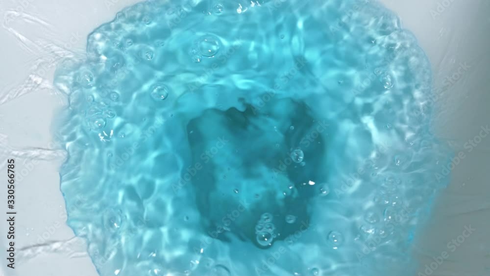 Bluewater is swirling in the toilet flush to clean and water being ...