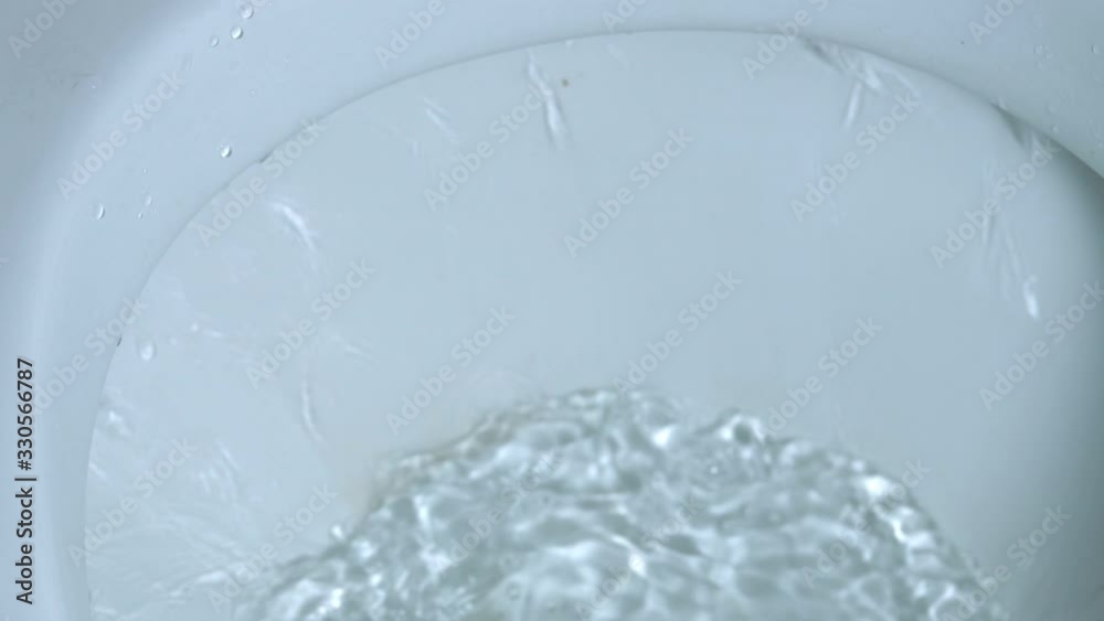 Video „water is swirling in the toilet flush to clean and water being ...