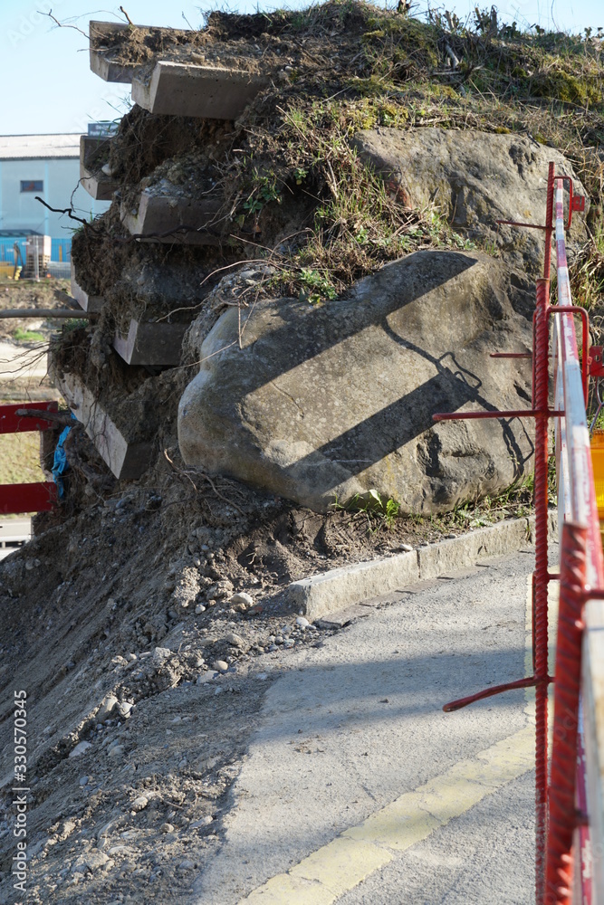 civil engineering construction site with a broken slope due to building ...