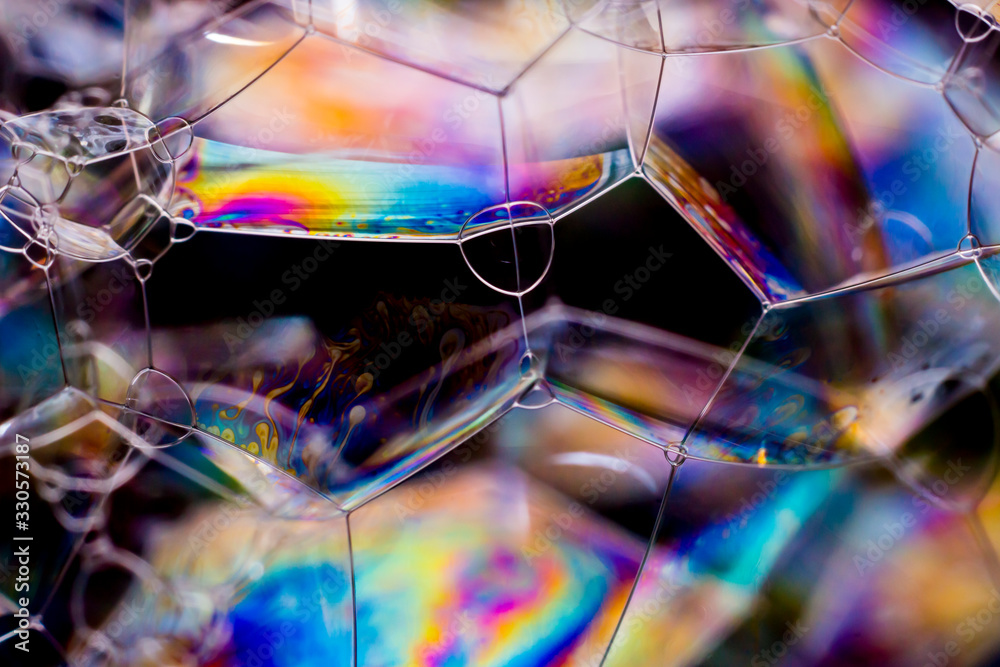 Macro photography of various soap bubbles creating different geometric ...