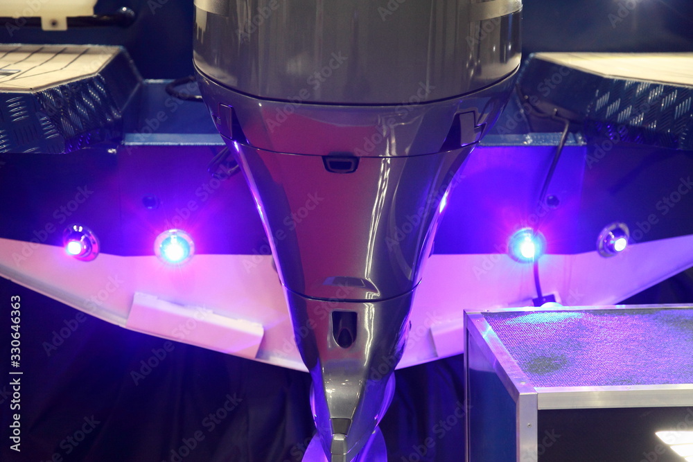 Blue underwater illuminated motor boat transom stern with lighting ...