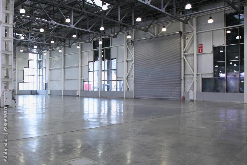 Empty modern storage warehouse indoor interior with clear floor and big ...