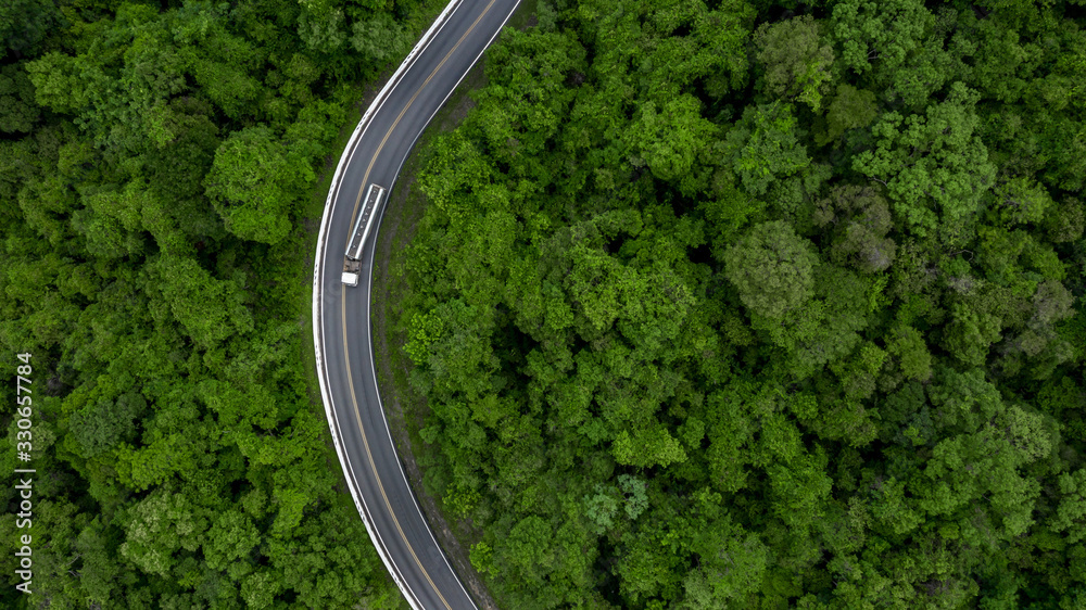 Aerial view road going through forest, Road through the green forest ...