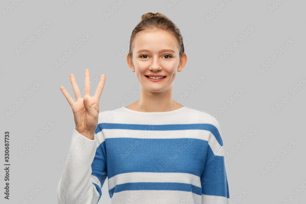 gesture, finger counting and people concept - smiling teenage girl ...